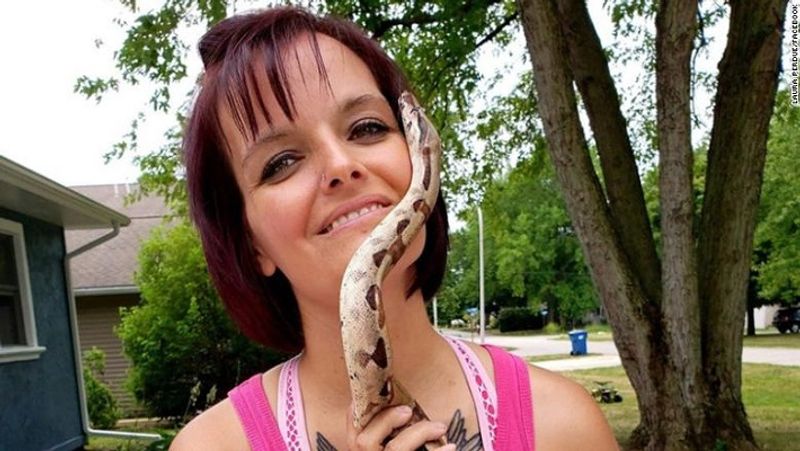 Python wrapped around neck of a woman fond of snakes, horrific death ...