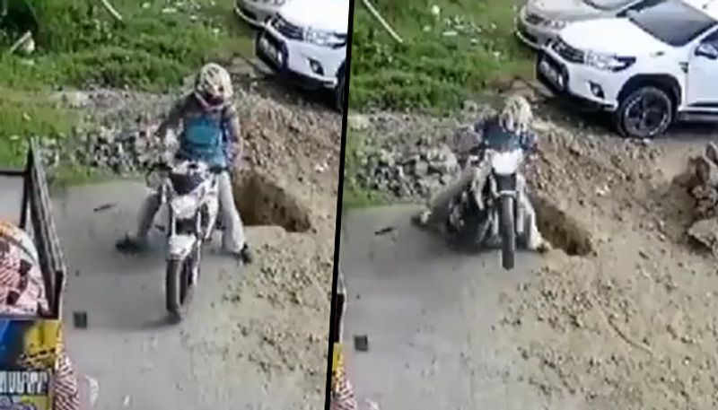 Man falls into pit while reversing a bike; video goes viral
