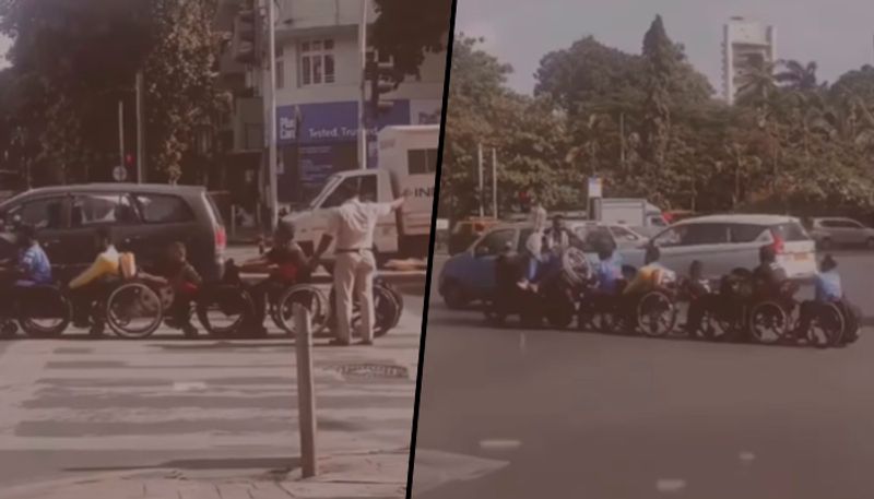 Mumbai traffic cop helps specially-abled people cross busy road ...