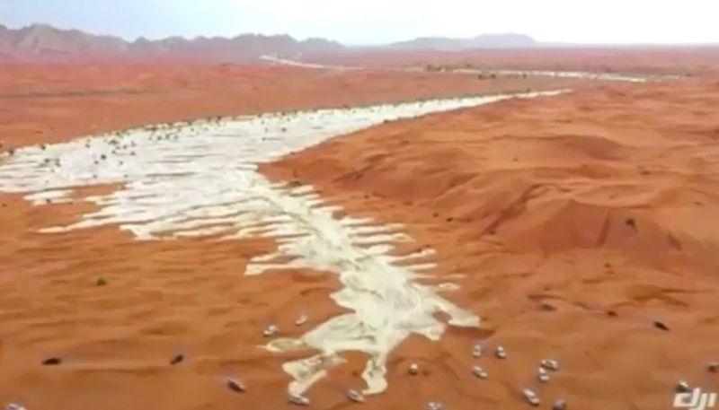Dubai floods: Dramatic aerial video of torrential rain waters entering city's desert surfaces ...