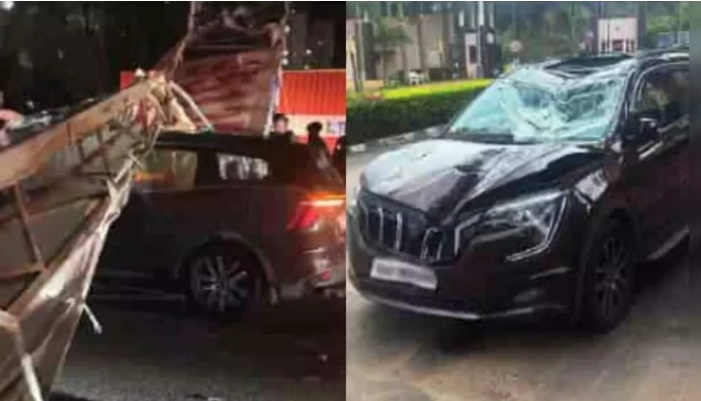 Huge hoarding fell over car during rain - 50 feet long illegal hoarding ...